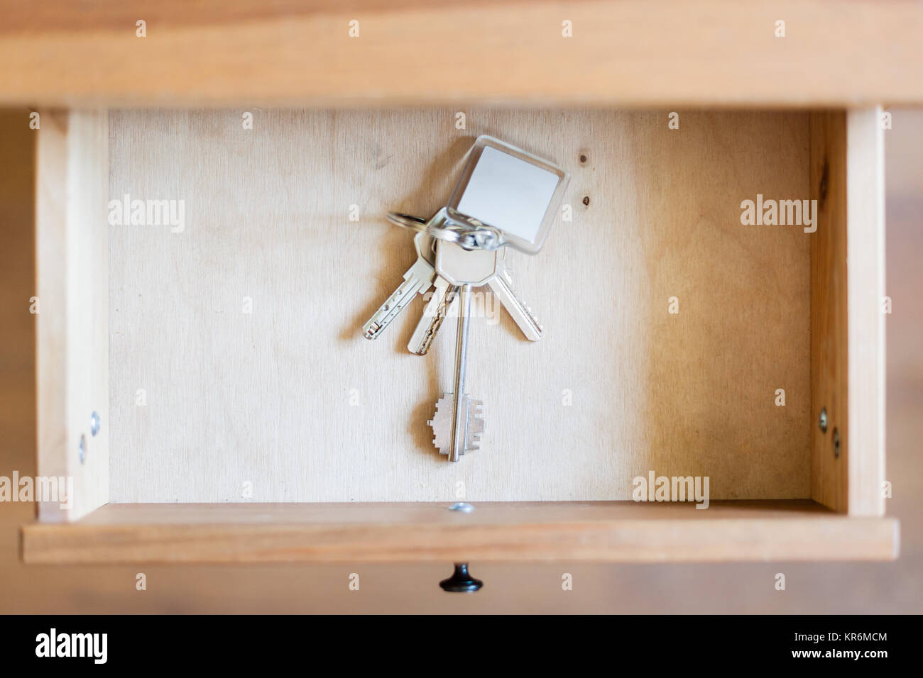 bunch of door keys with keyfob in open drawer Stock Photo - Alamy