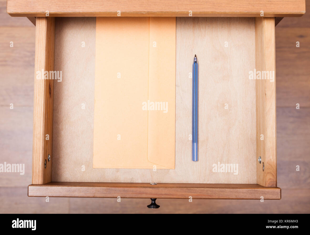 blue pen and envelope in open drawer Stock Photo - Alamy