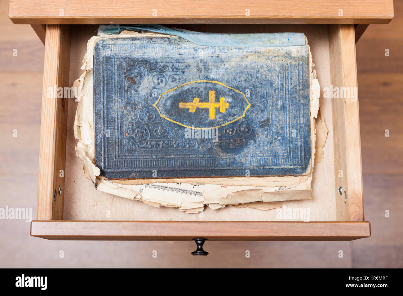 old religious book in open drawer Stock Photo - Alamy