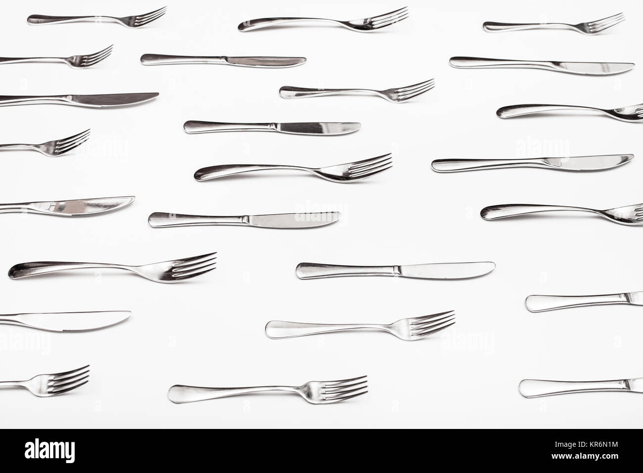side view of many table knives and forks Stock Photo - Alamy