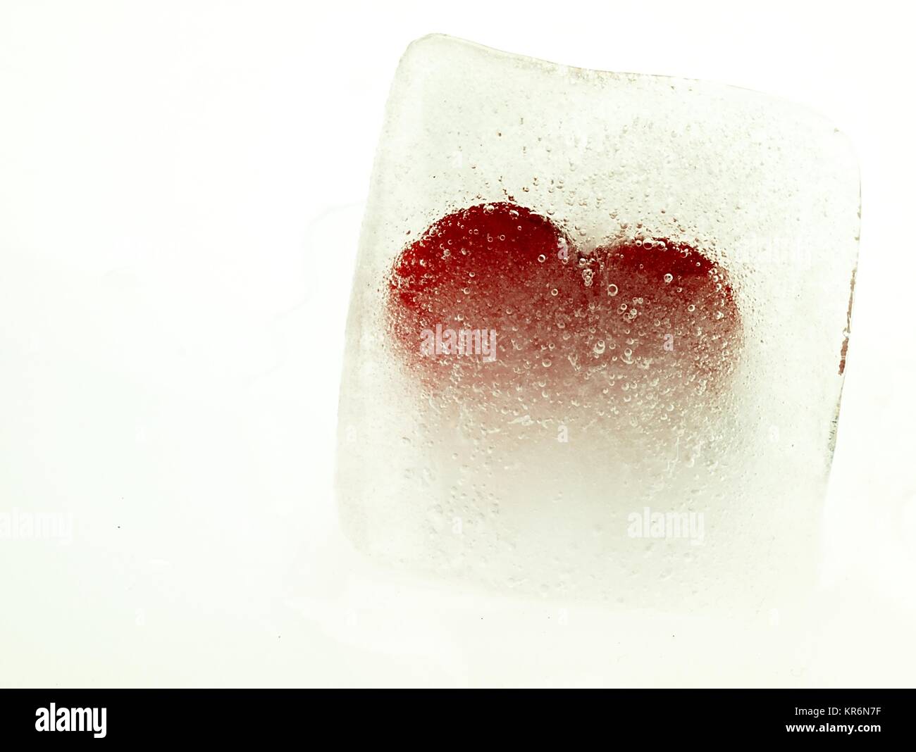 Red heart embedded in ice Stock Photo - Alamy