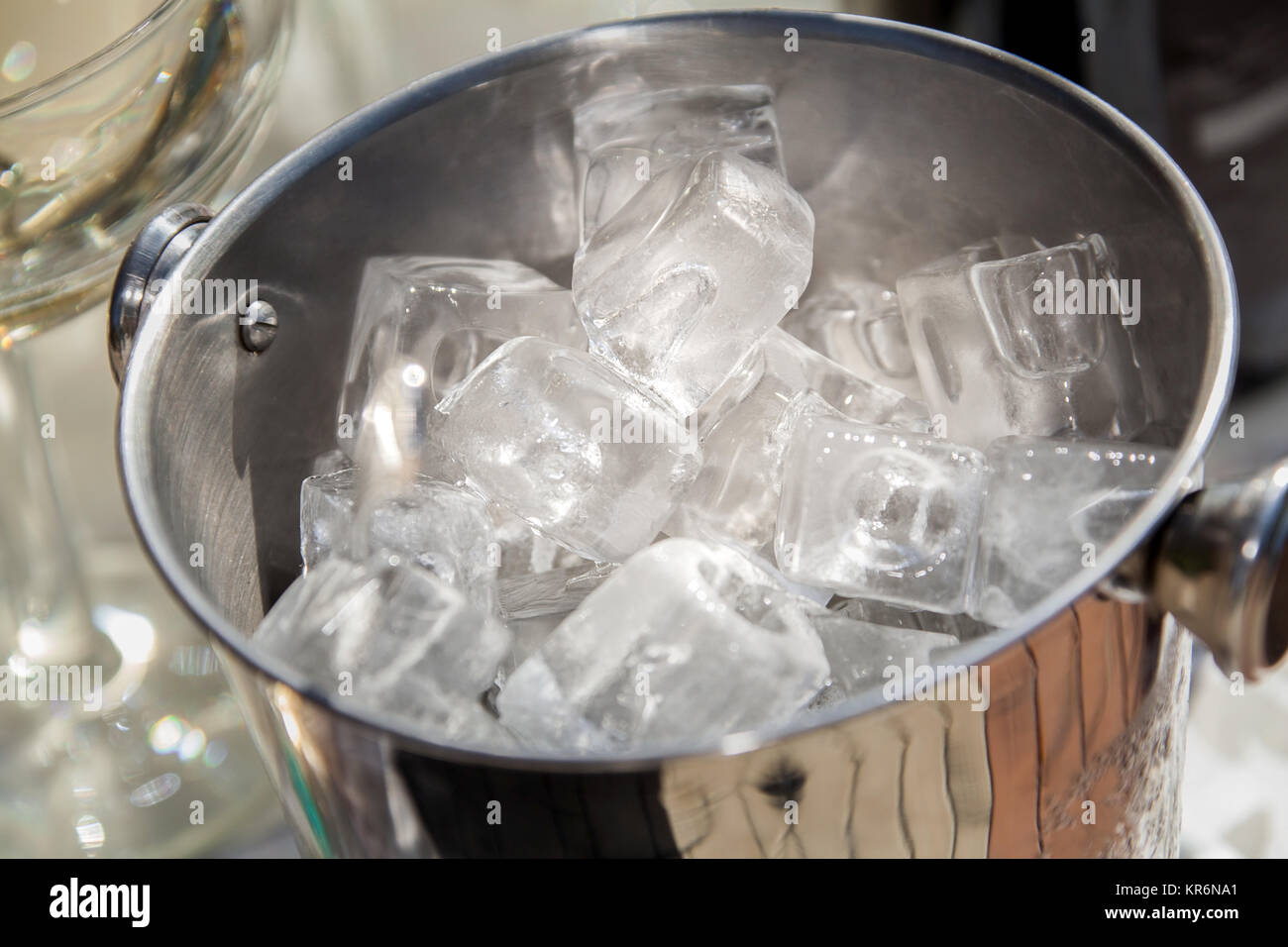 Bucket with ice cubes Stock Photo - Alamy