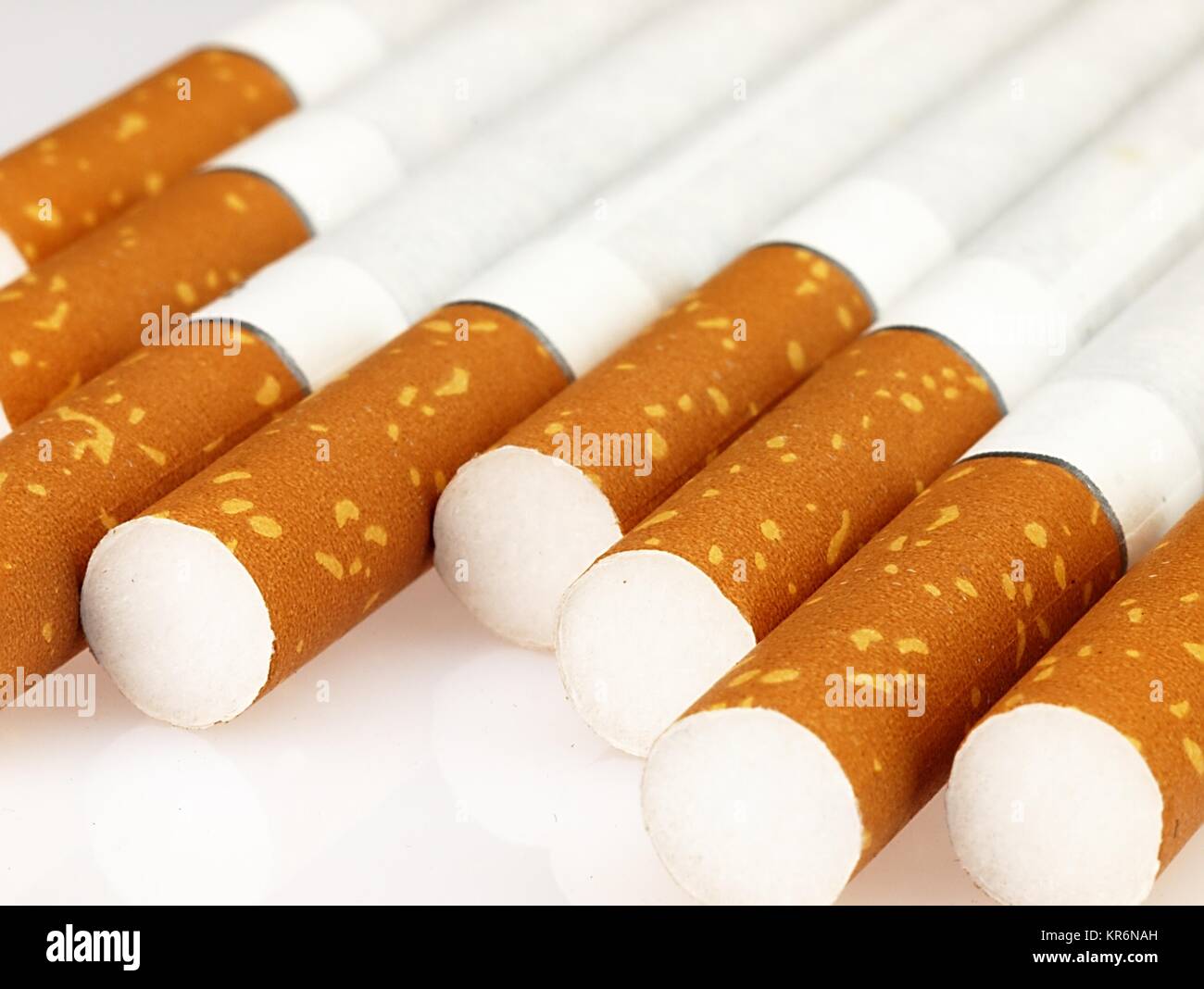Several cigarettes on a white background Stock Photo - Alamy