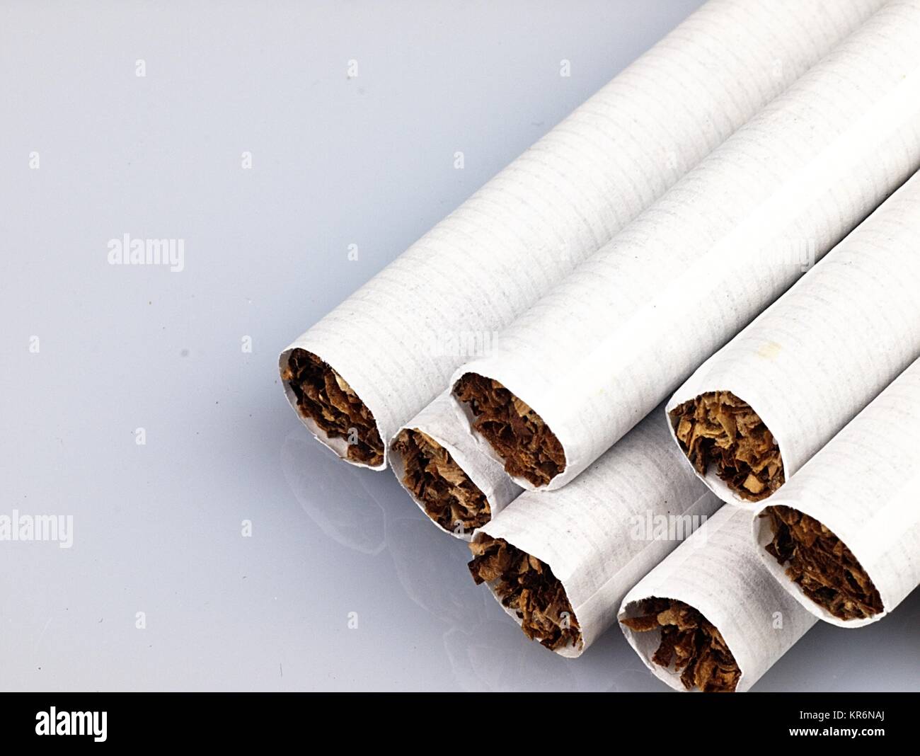 Several cigarettes on a white background Stock Photo - Alamy