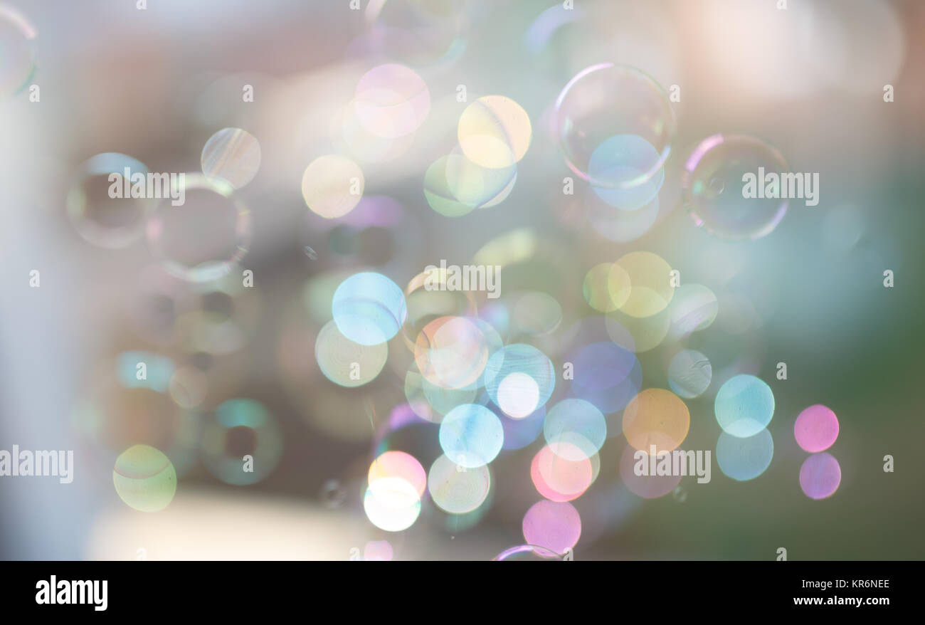 Photo of soap bubbles into the sunlight with beautiful bokeh, pastel ...