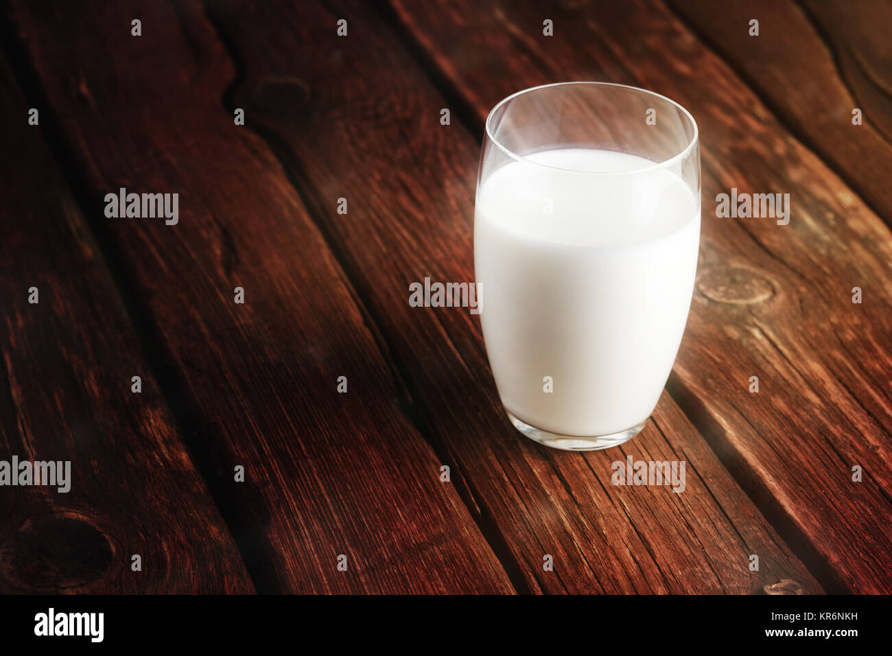 Glass of fresh milk on old wooden background Stock Photo - Alamy