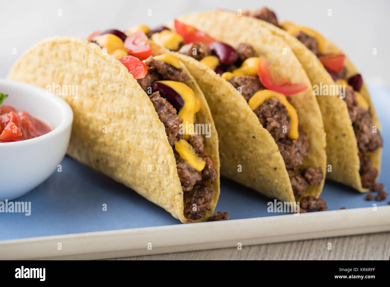 Mexican tacos with beef, cheddar cheese, tomato Stock Photo - Alamy