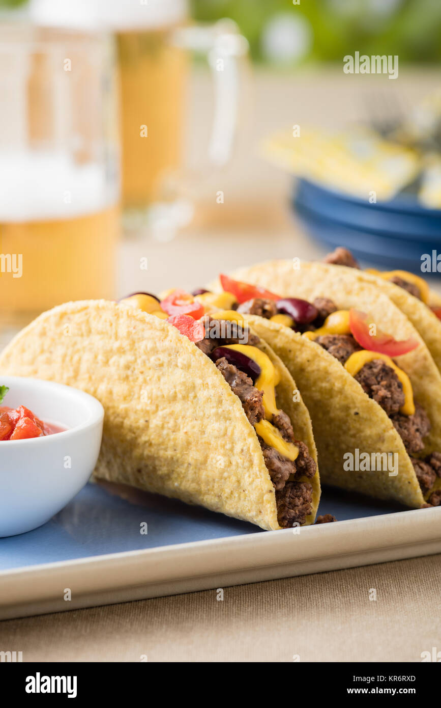 Mexican tacos with beef, cheddar cheese, tomato Stock Photo - Alamy