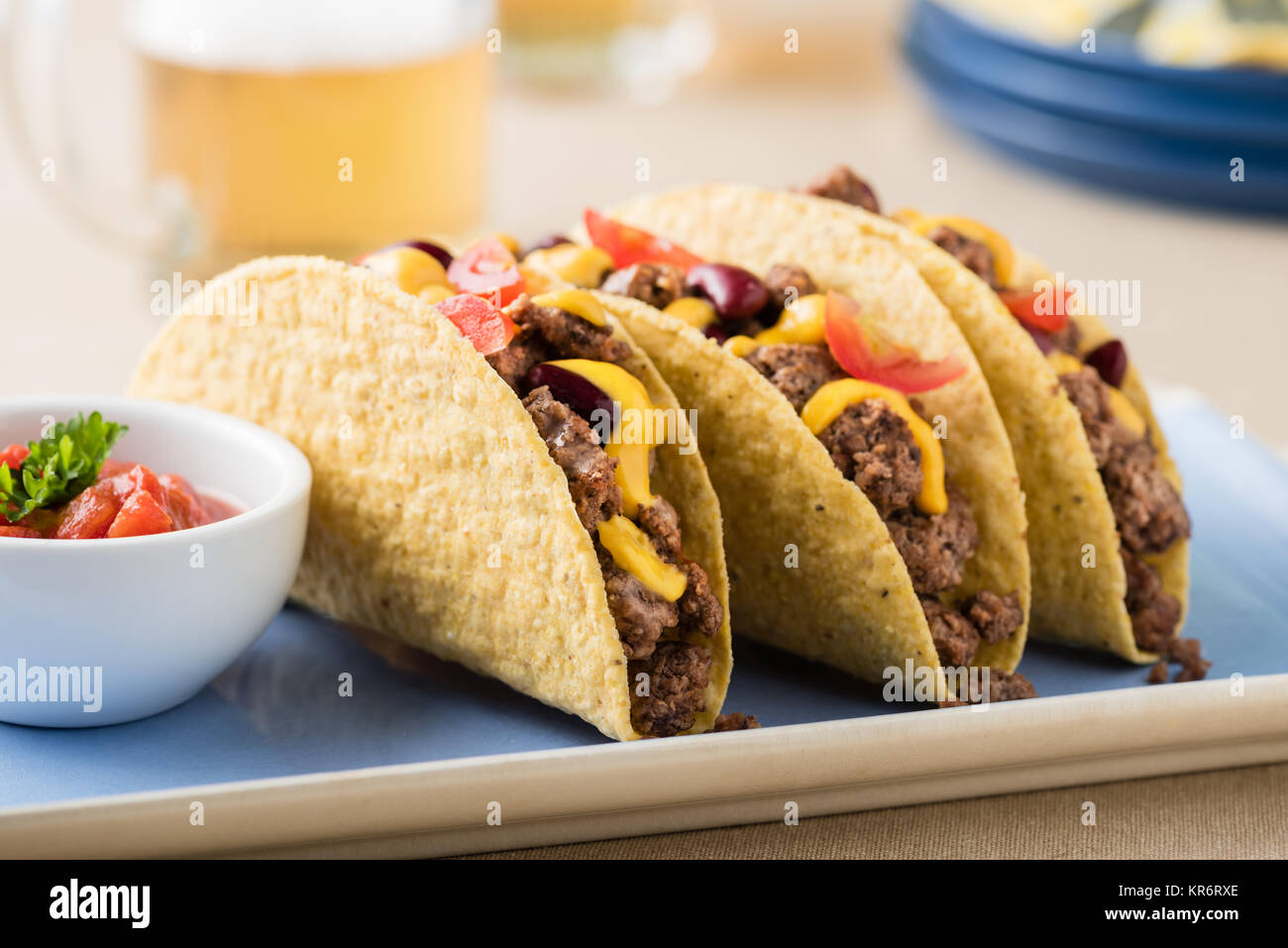 Mexican tacos with beef, cheddar cheese, tomato Stock Photo - Alamy