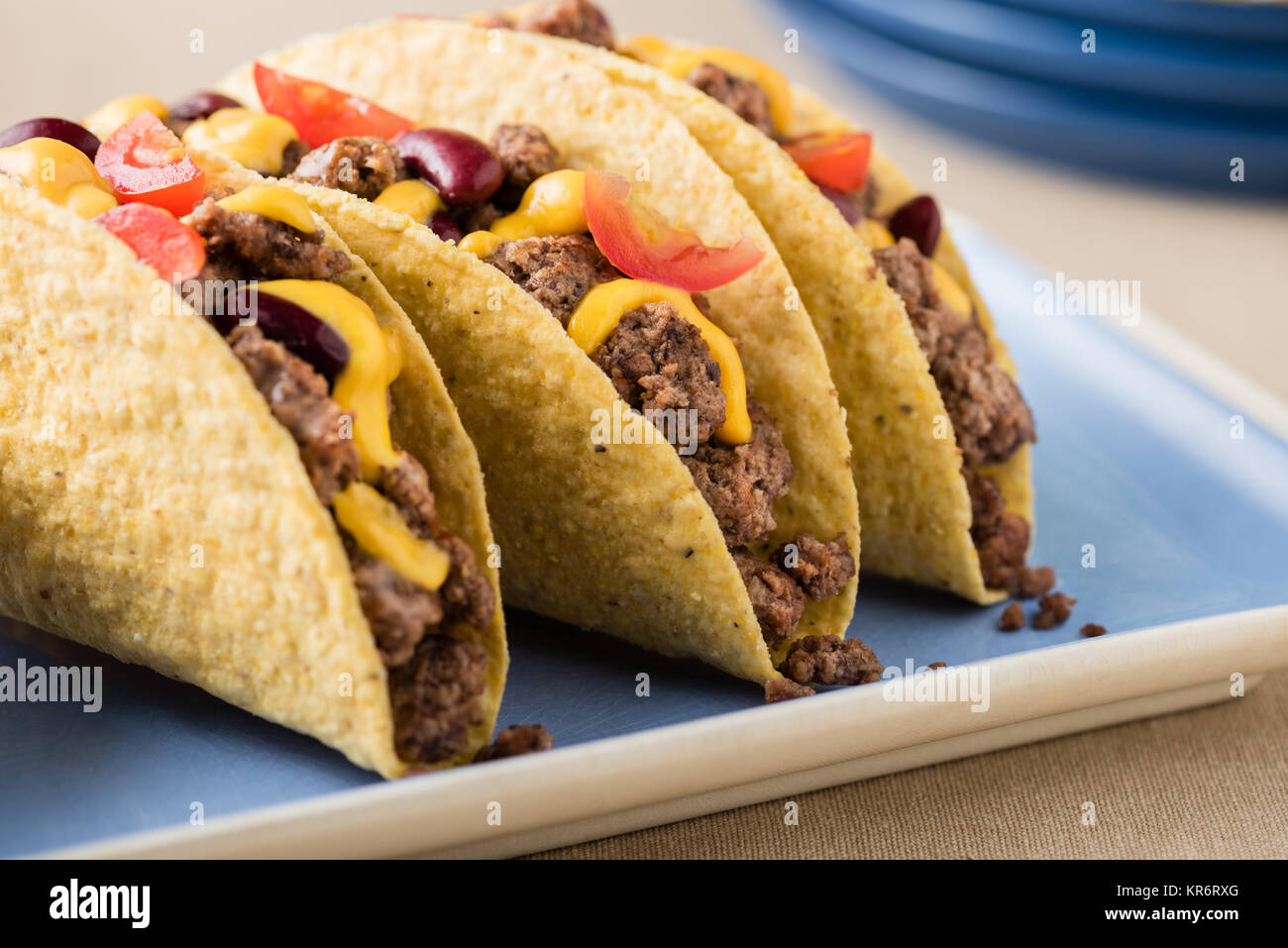 Mexican tacos with beef, cheddar cheese, tomato Stock Photo - Alamy