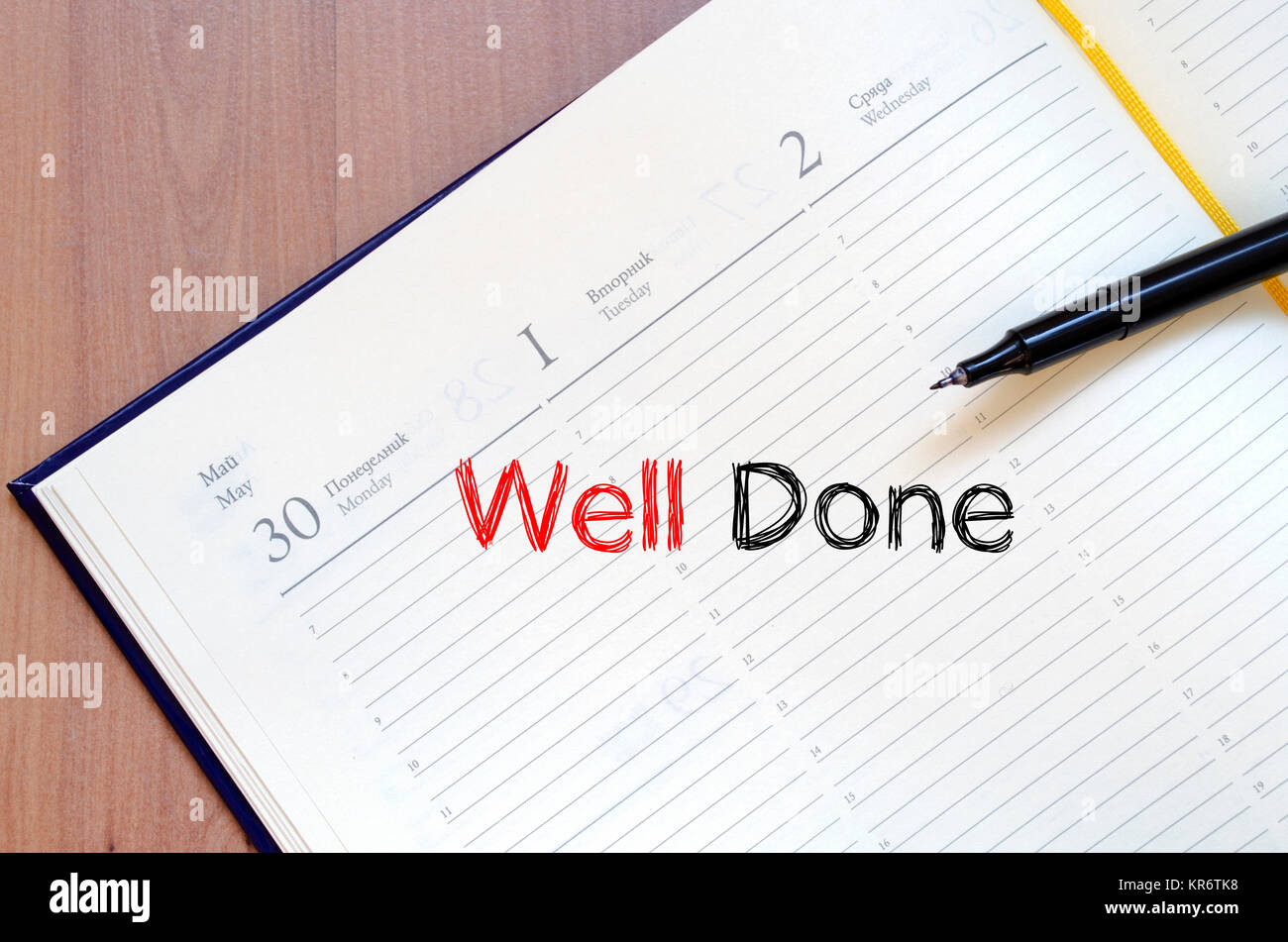 Well done text concept on notebook Stock Photo - Alamy