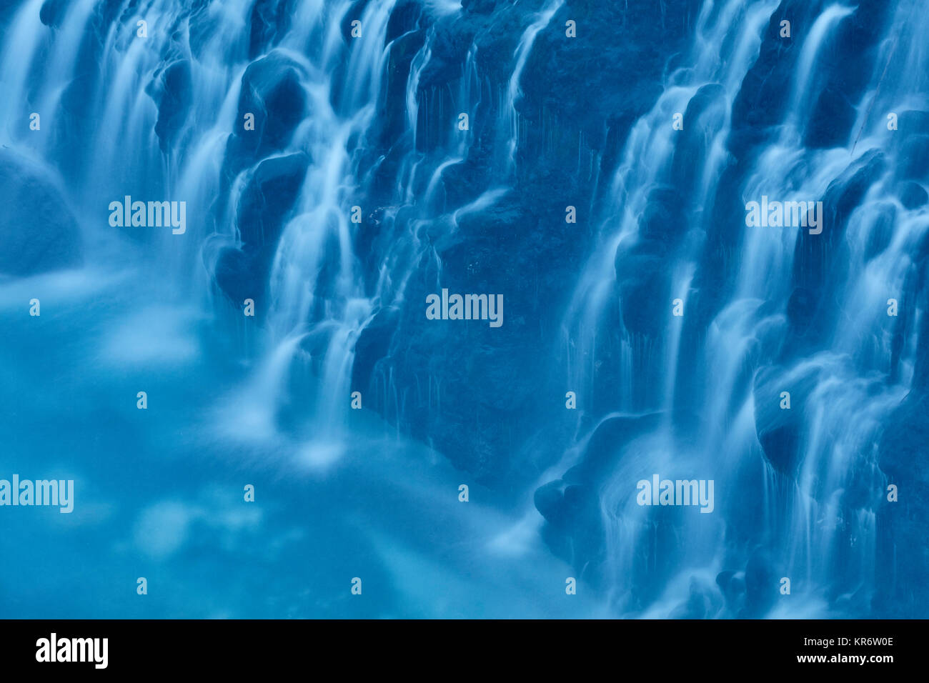 Close up of cobalt blue water cascading at White Beard Waterfall ...