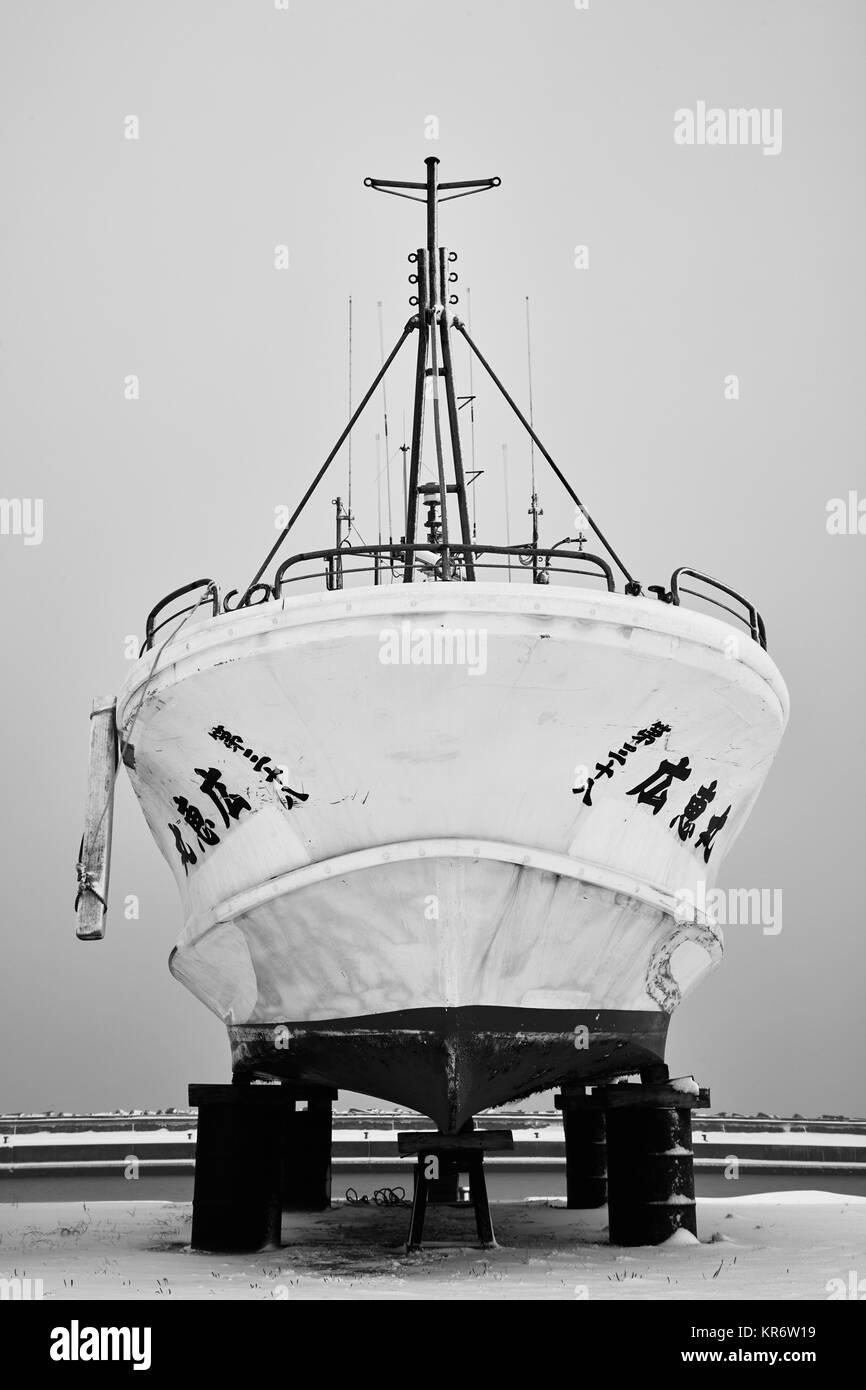 Fishing boat on a dry platform in winter Stock Photo - Alamy