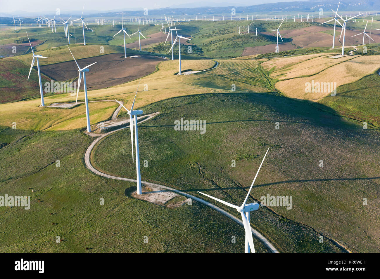 High angle view of rolling landscape with fields and wind turbines ...