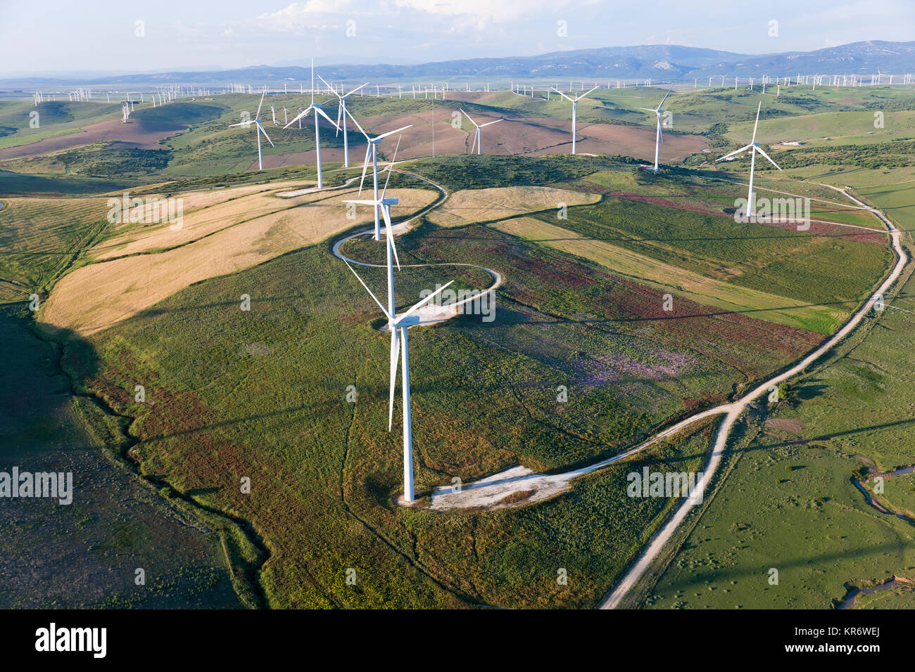 High angle view of rolling landscape with fields and wind turbines ...