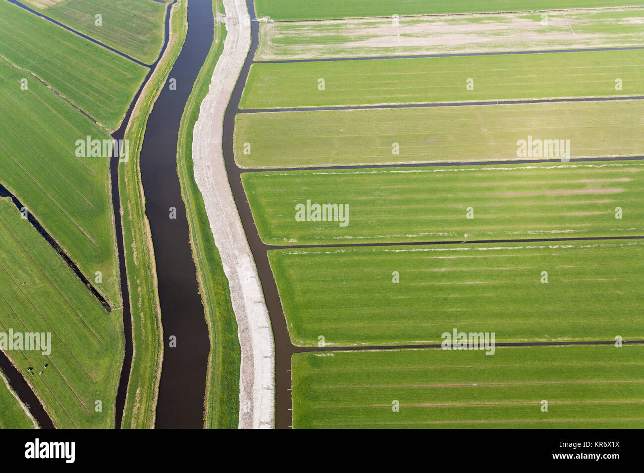 Aerial view of canal and dyke running through reclaimed low-lying ...