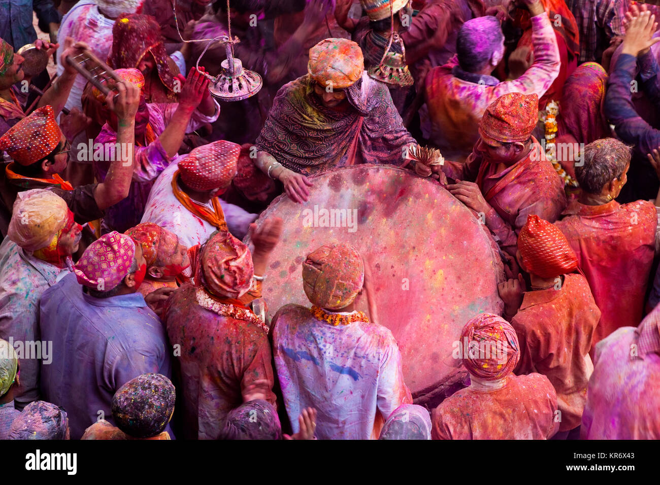 High angle view of crowds of people covered in colour at Holi, a Hindu ...