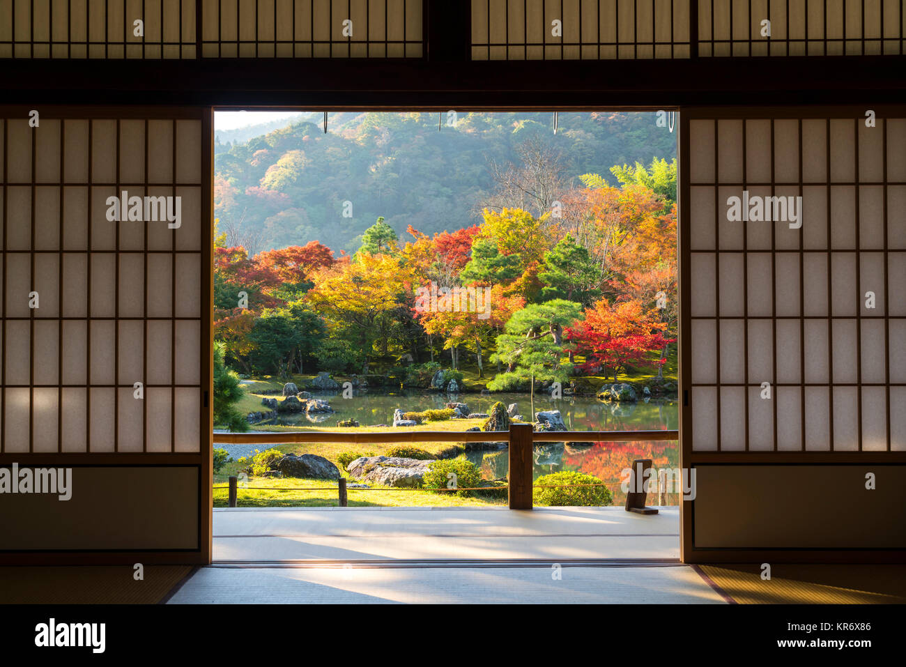 View through traditional Japanese sliding door into an autumn park ...