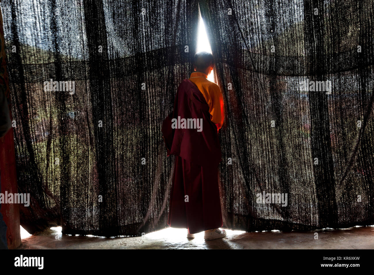 Buddhist monk wearing red hi-res stock photography and images - Alamy