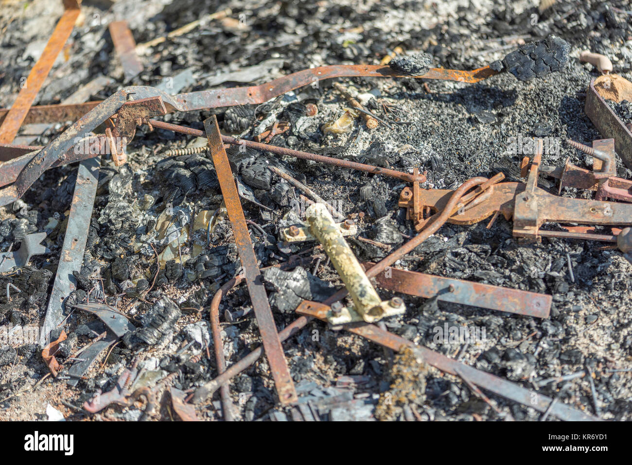 scrap metal remains at a burnt fireplace Stock Photo - Alamy