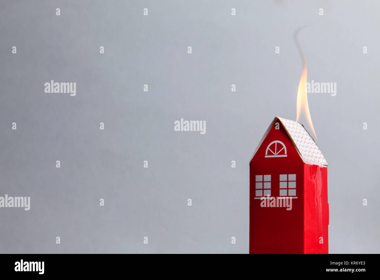 House fire concept. Toy house with flames Stock Photo - Alamy