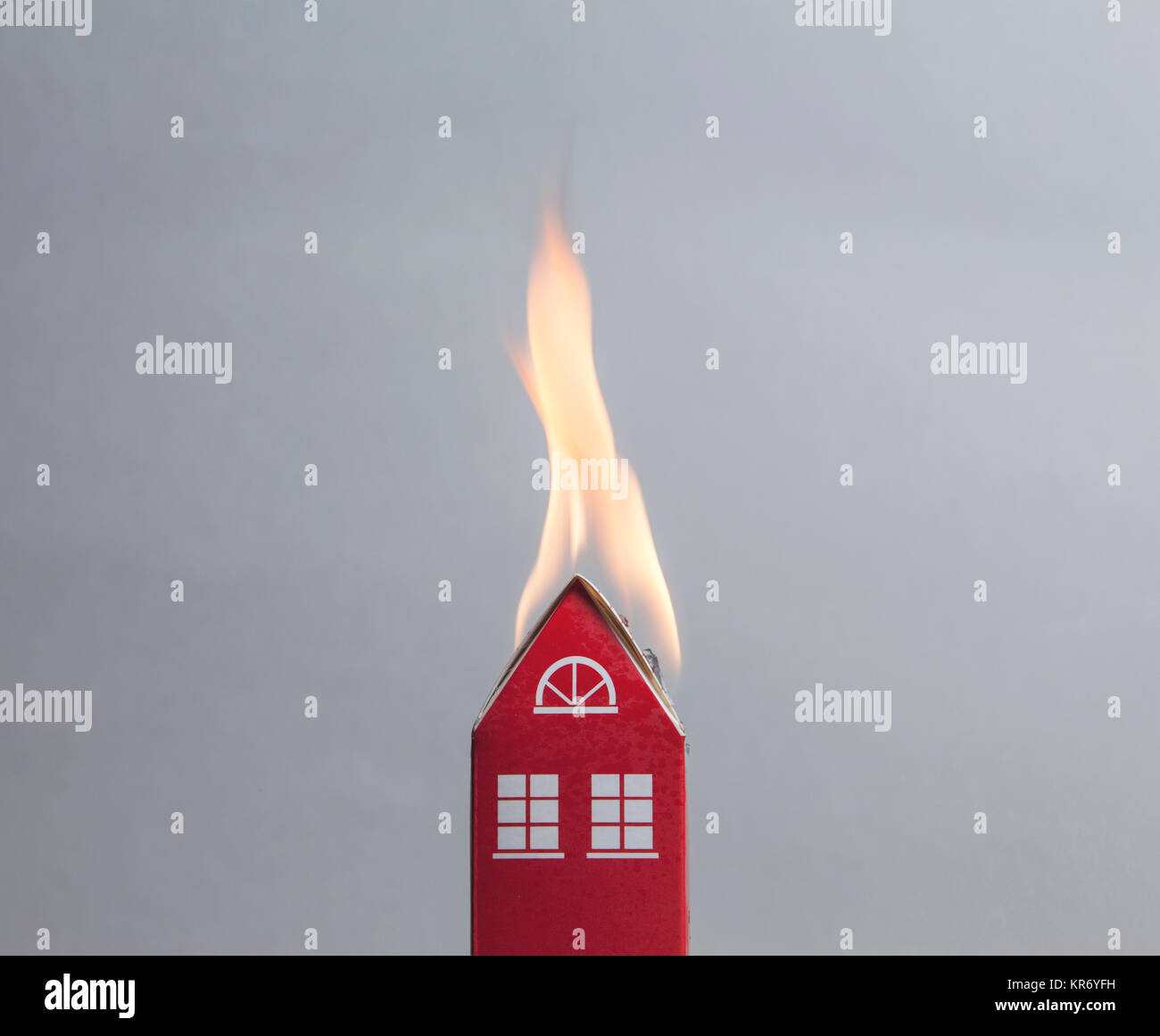 House fire concept. Toy house with flames Stock Photo - Alamy
