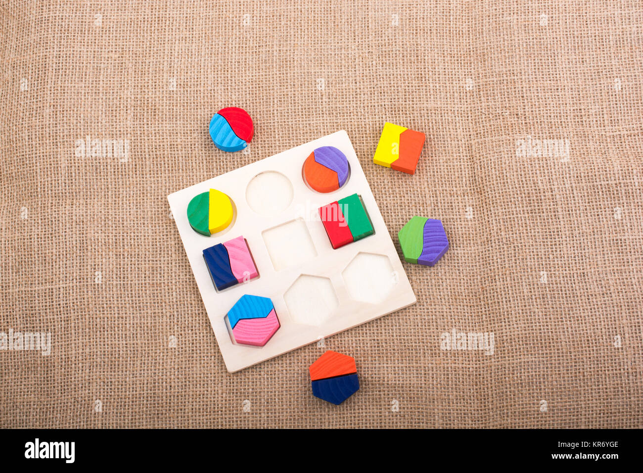 Colorful wooden pieces of a logic puzzle Stock Photo - Alamy