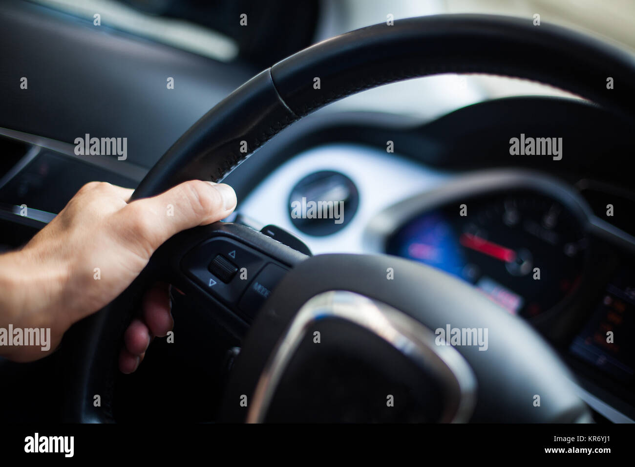 Hands on steering wheel Stock Photo - Alamy