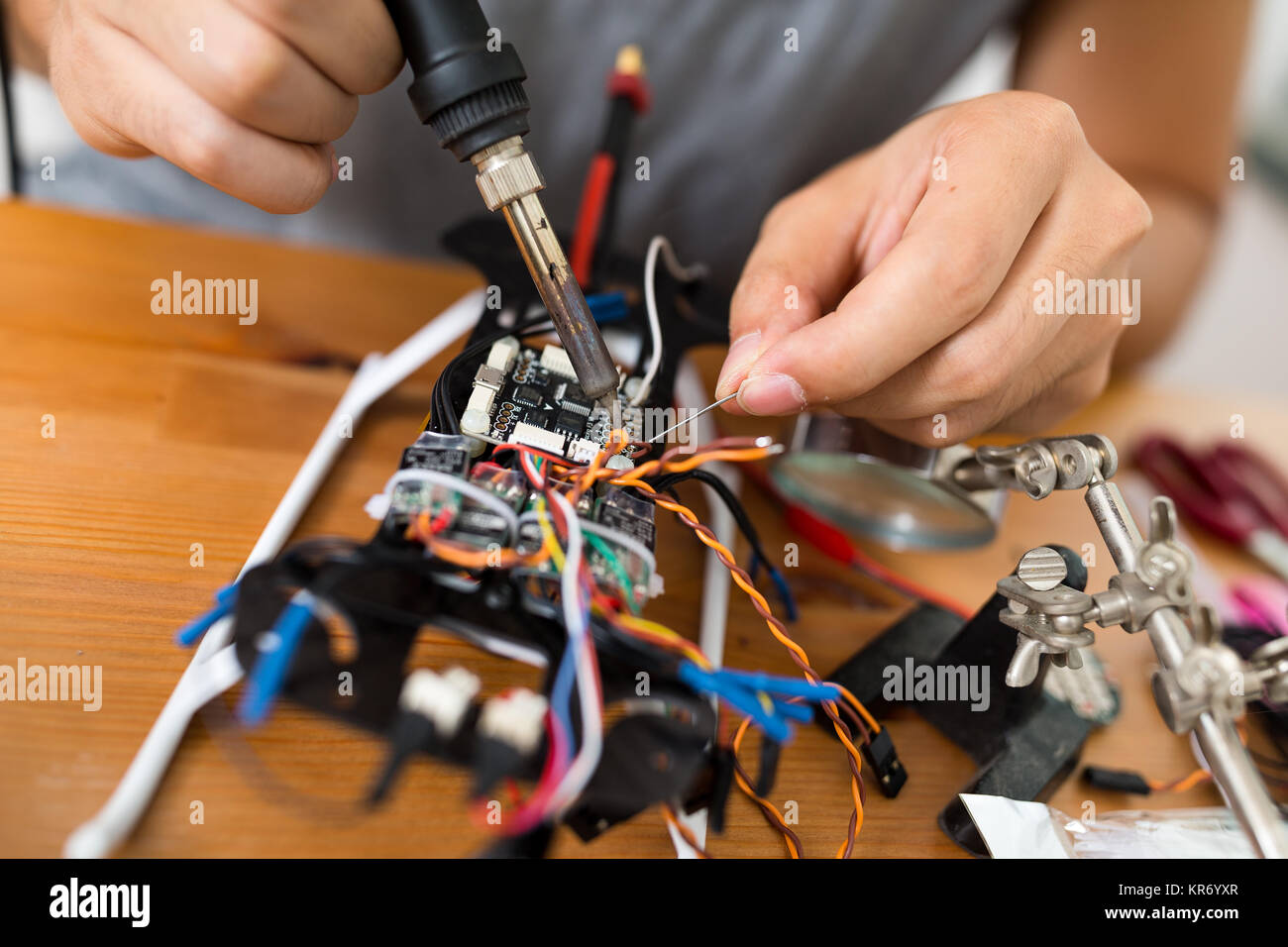 Building drone with welding tool Stock Photo - Alamy