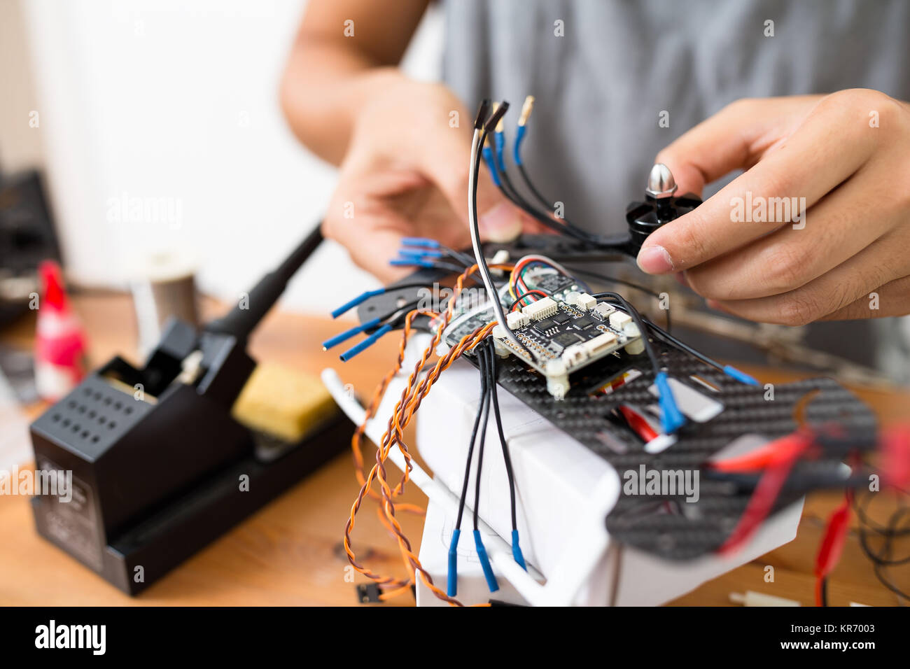 Connecting the wire on flying drone Stock Photo - Alamy
