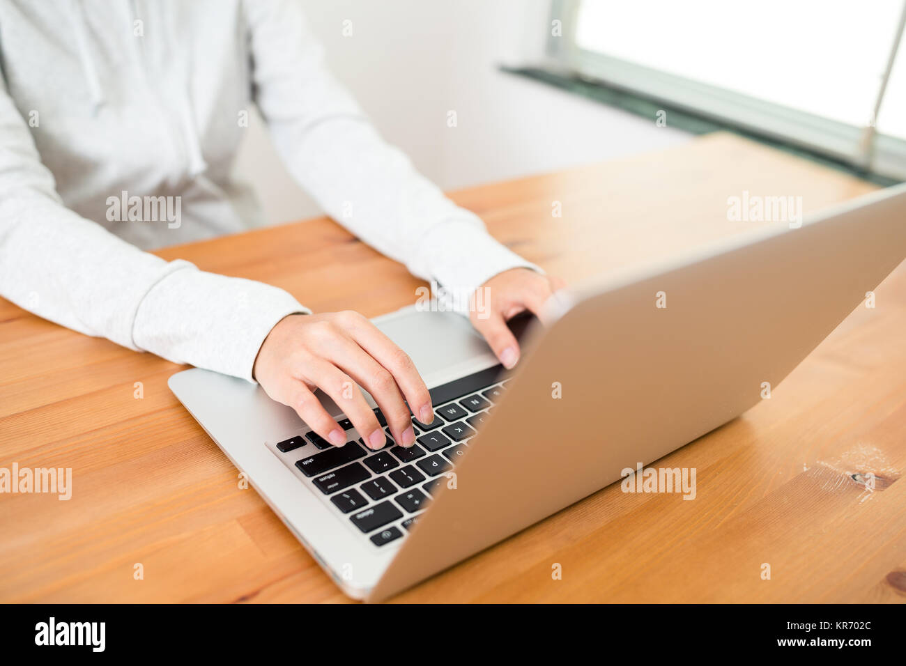Woman using lapotp computer Stock Photo - Alamy