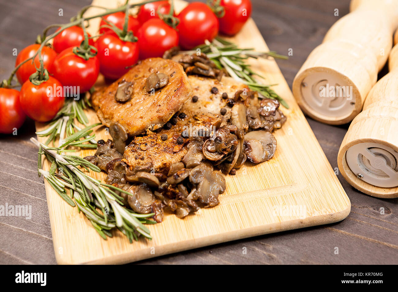 Close up top view on pork steak with grilled mushrooms Stock Photo - Alamy