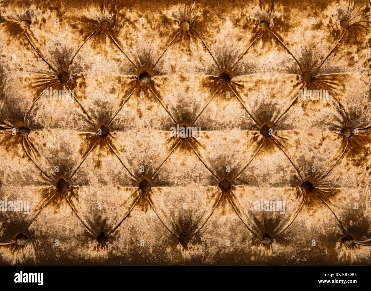 Golden capitone tufted velvet upholstery texture Stock Photo - Alamy