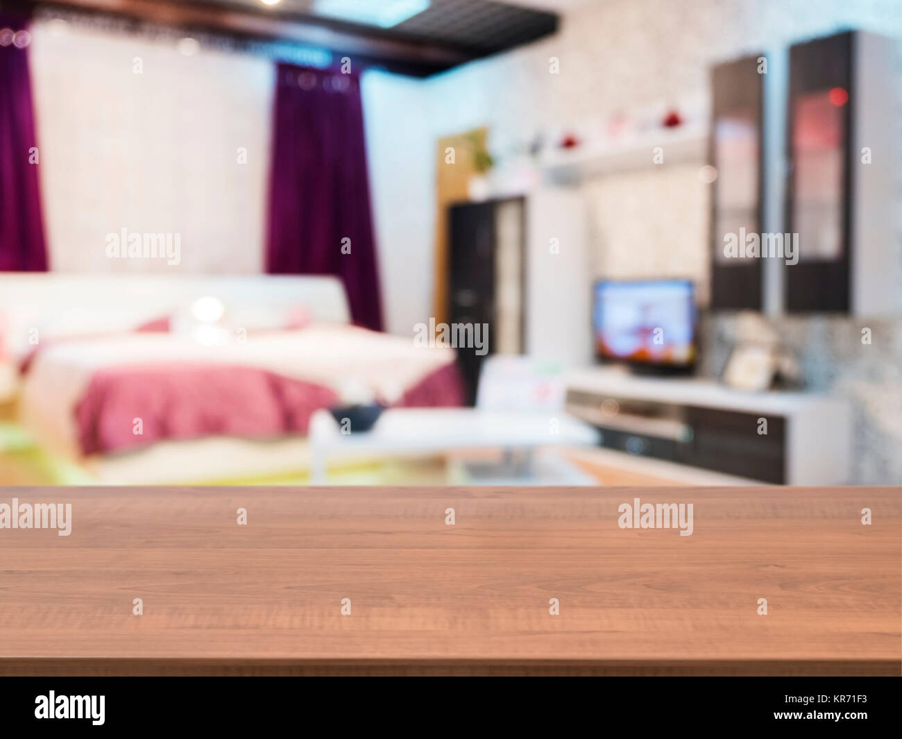 Wooden empty table in front of blurred bedroom Stock Photo - Alamy