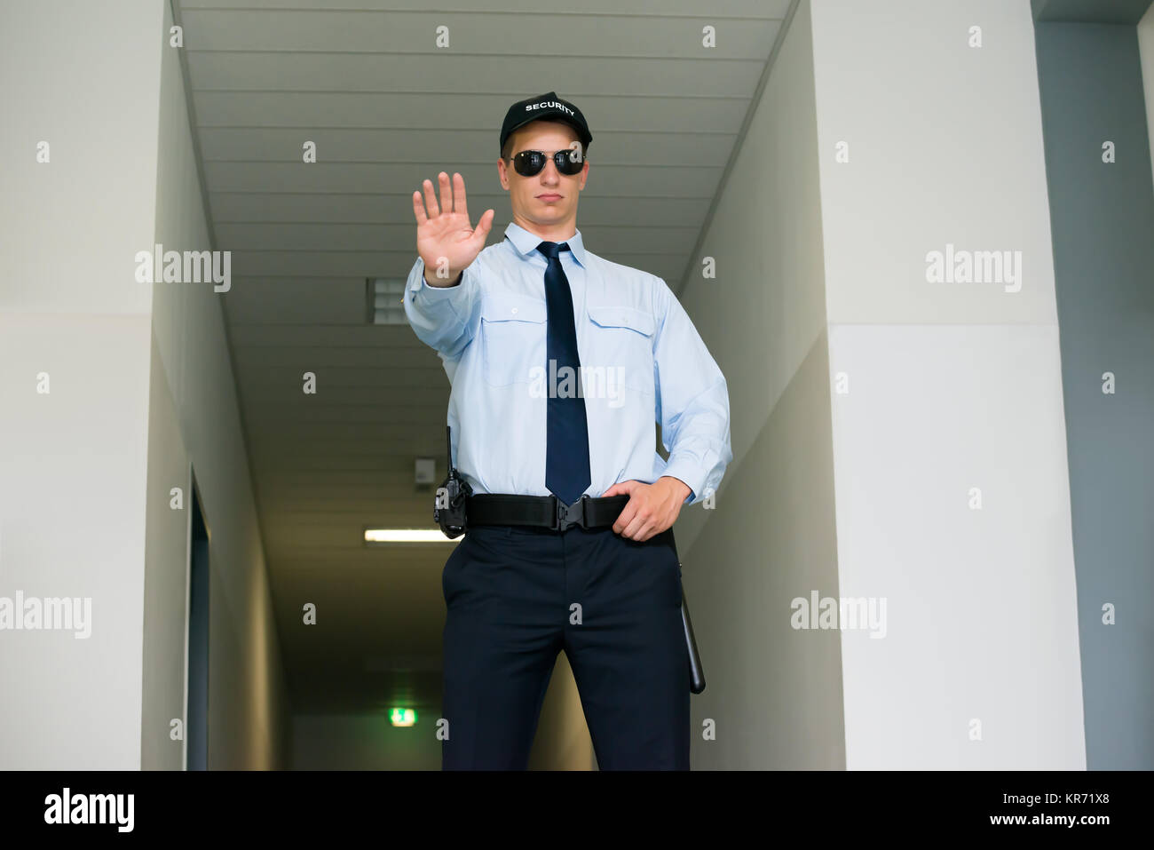 Security Guard Making Stop Gesture Stock Photo - Alamy