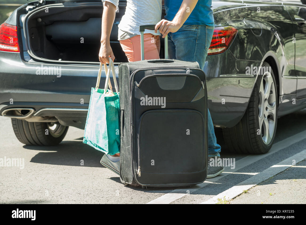 Couple man woman hand luggage one hi-res stock photography and images ...