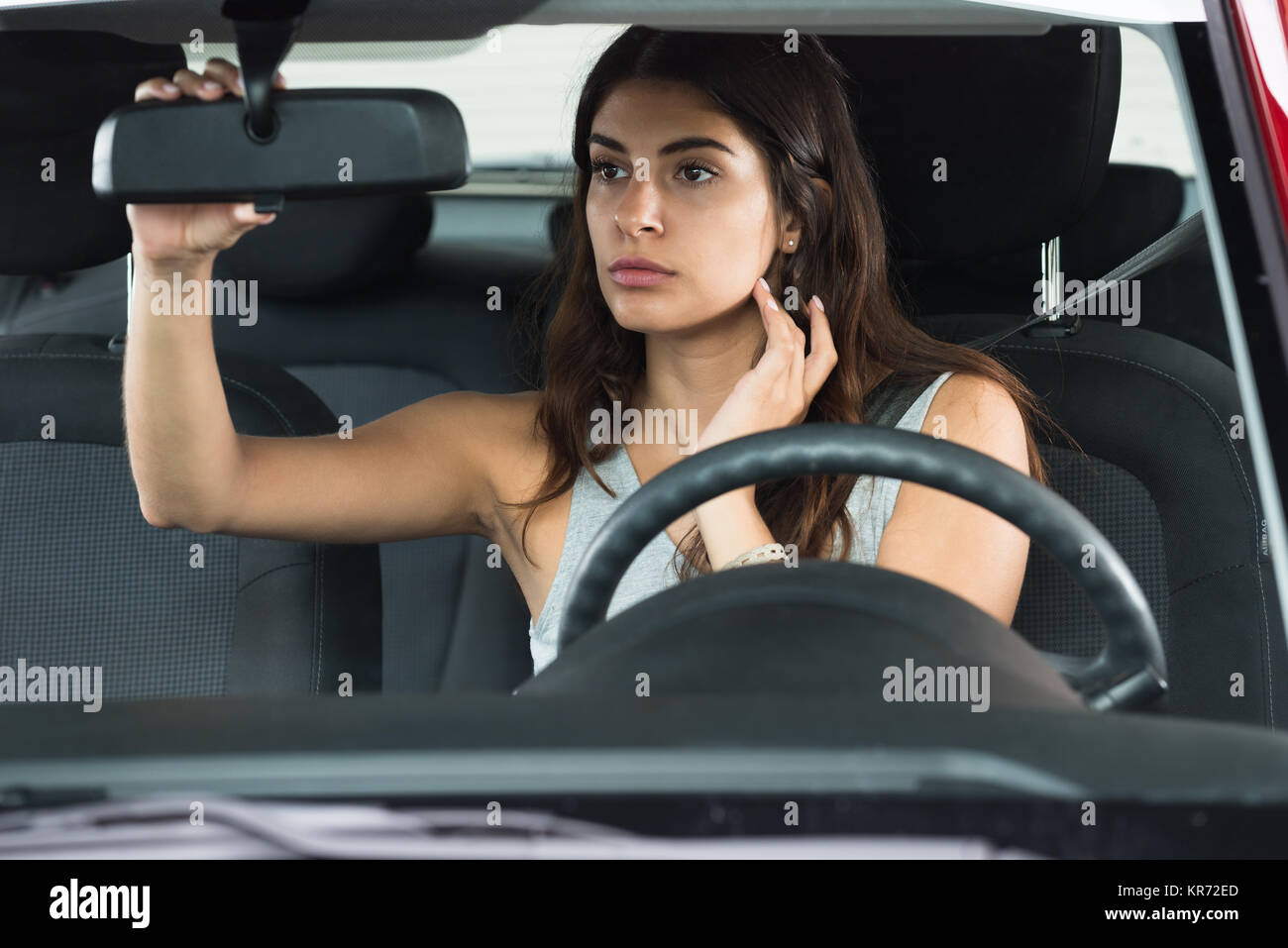 Young Woman Sitting Inside Car Stock Photo - Alamy