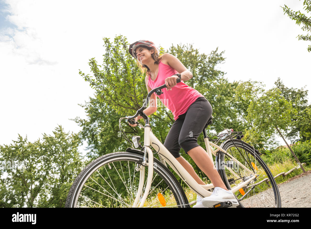 Happy Female Cyclist Riding Bicycle Stock Photo - Alamy