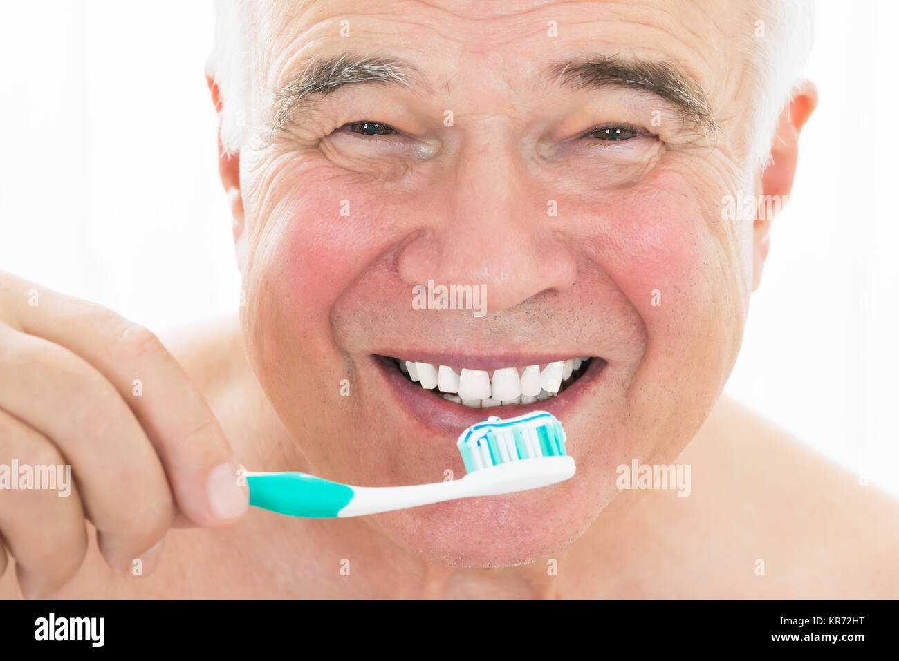Happy Senior Man Brushing His Teeth Stock Photo - Alamy
