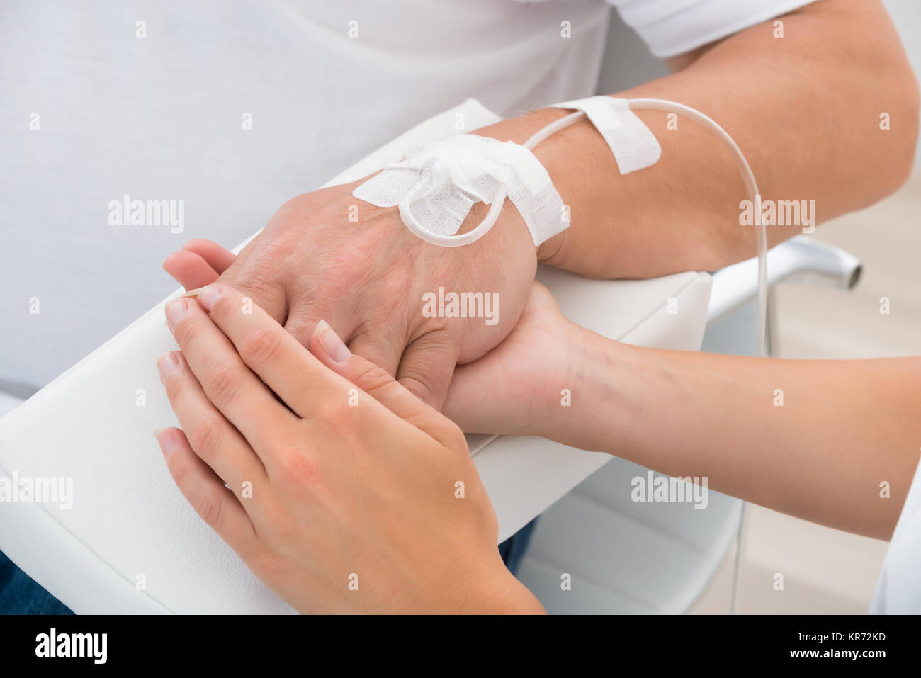 Doctor Holding Patient's Hand Stock Photo - Alamy