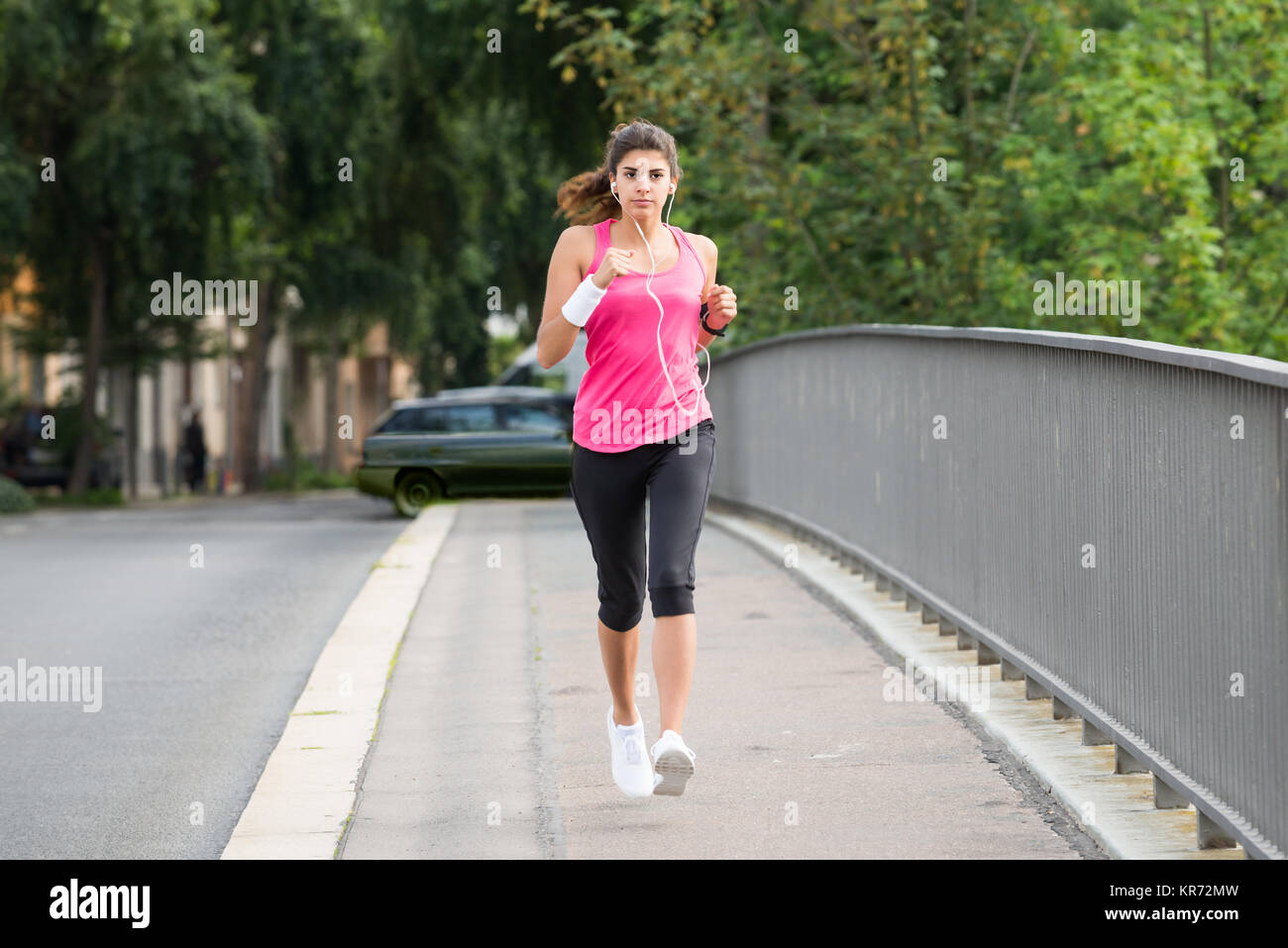 Athlete Woman Running On Sidewalk Stock Photo - Alamy