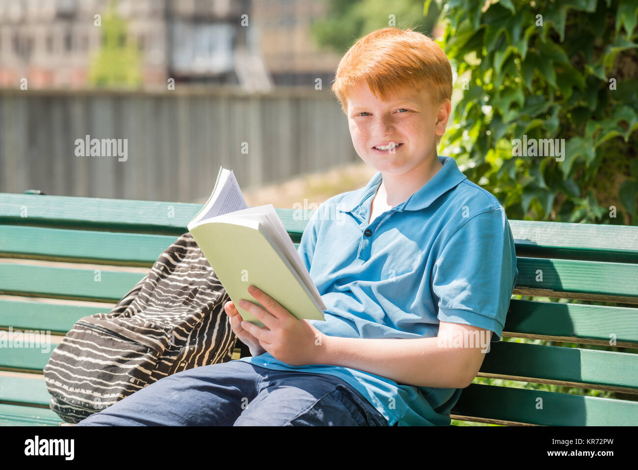 Schoolboy Reading Book Stock Photo - Alamy Schoolboy Reading Book Stock Photo - Alamy