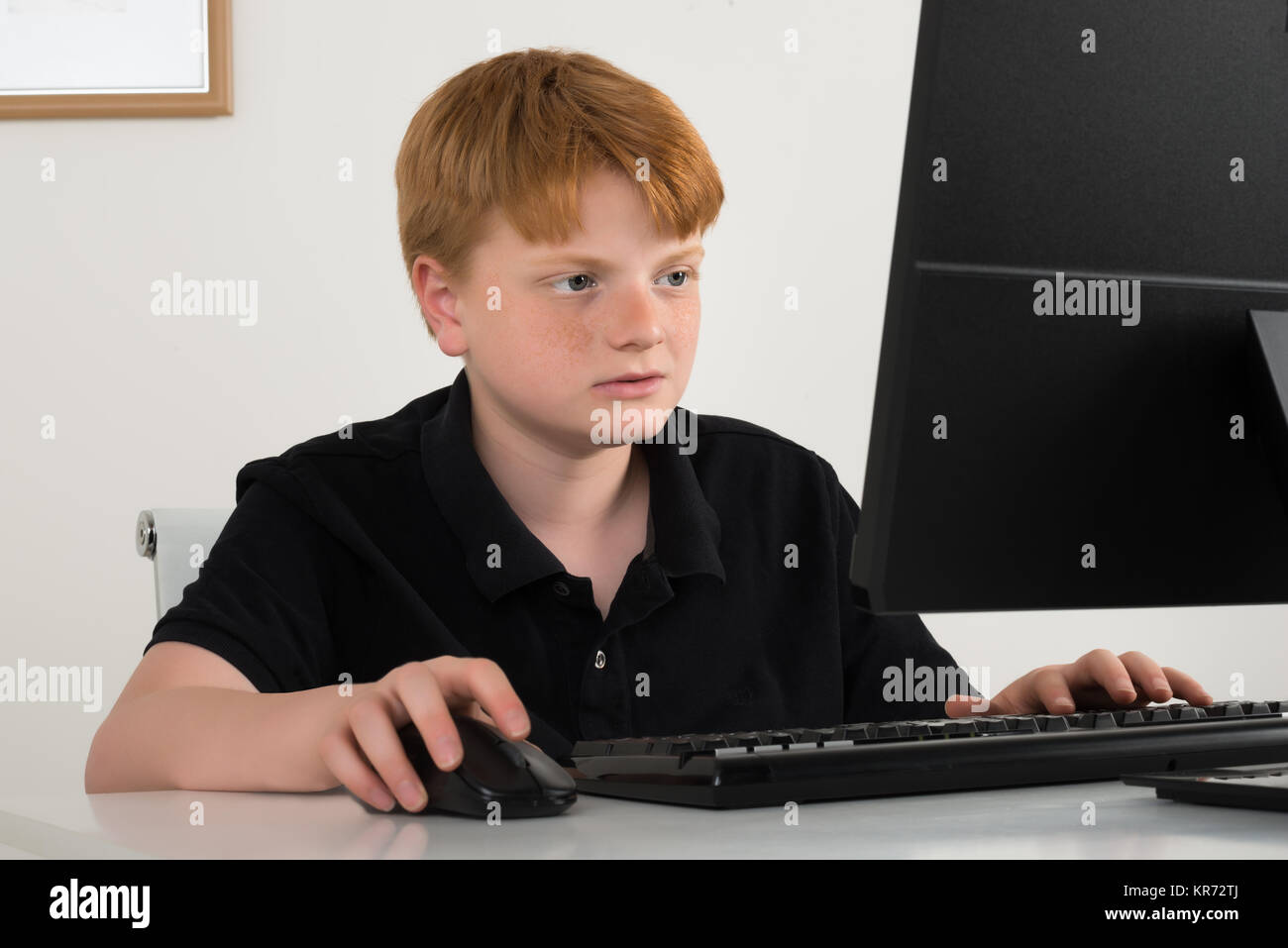 Boy Using Computer Stock Photo - Alamy