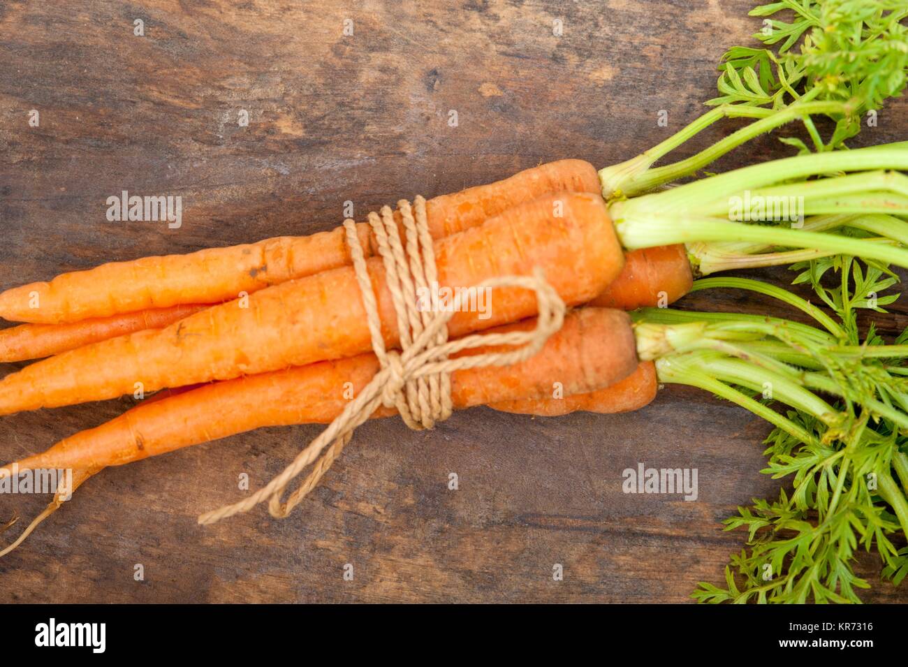 baby carrots bunch tied with rope Stock Photo - Alamy