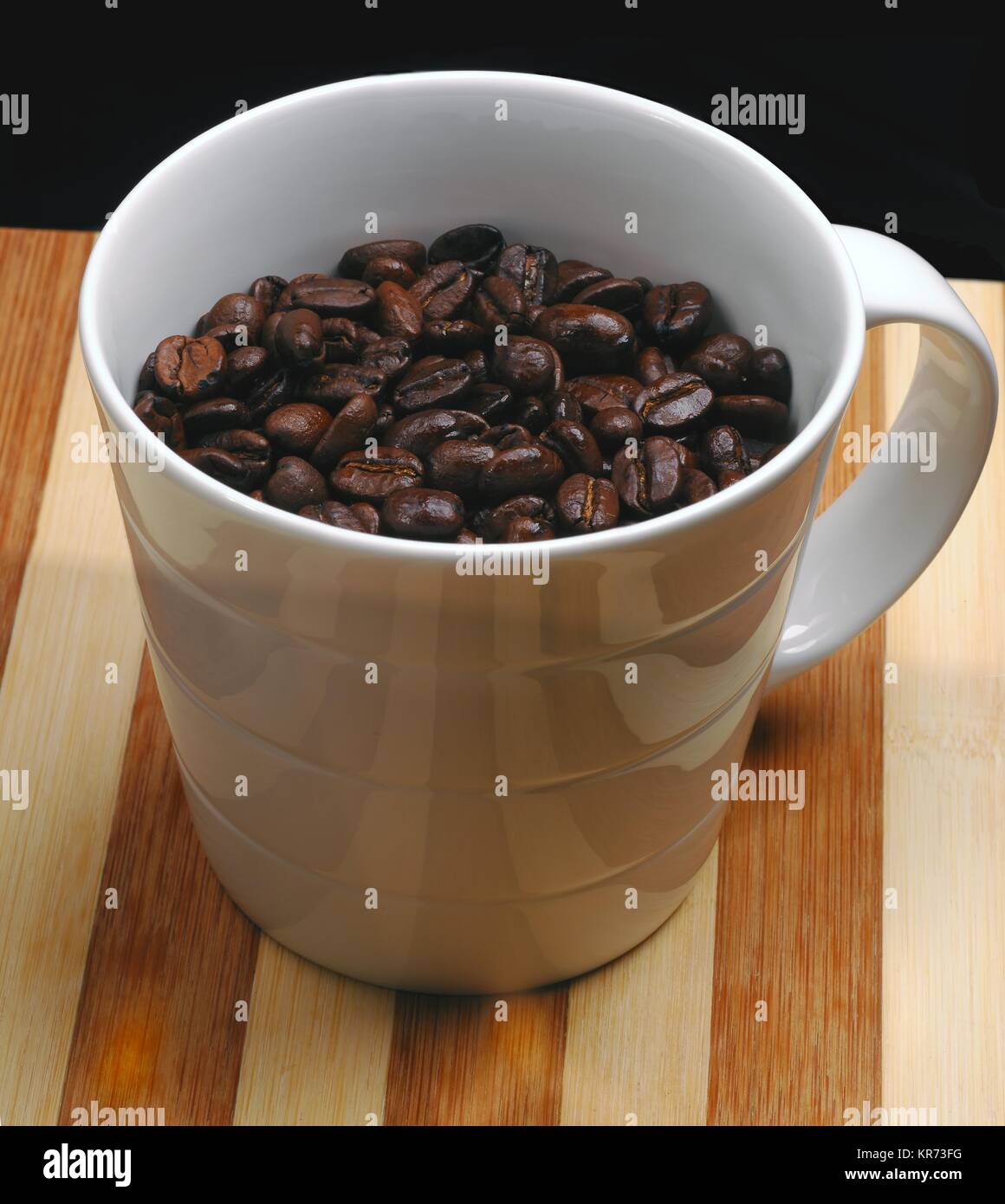 coffee beans on a cup Stock Photo - Alamy