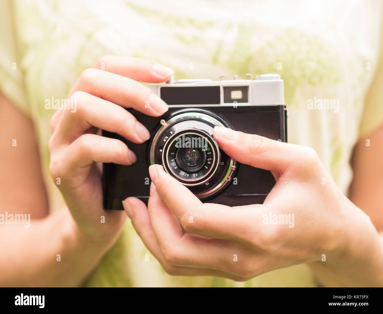 Close up of woman hand holding retro camera Stock Photo - Alamy