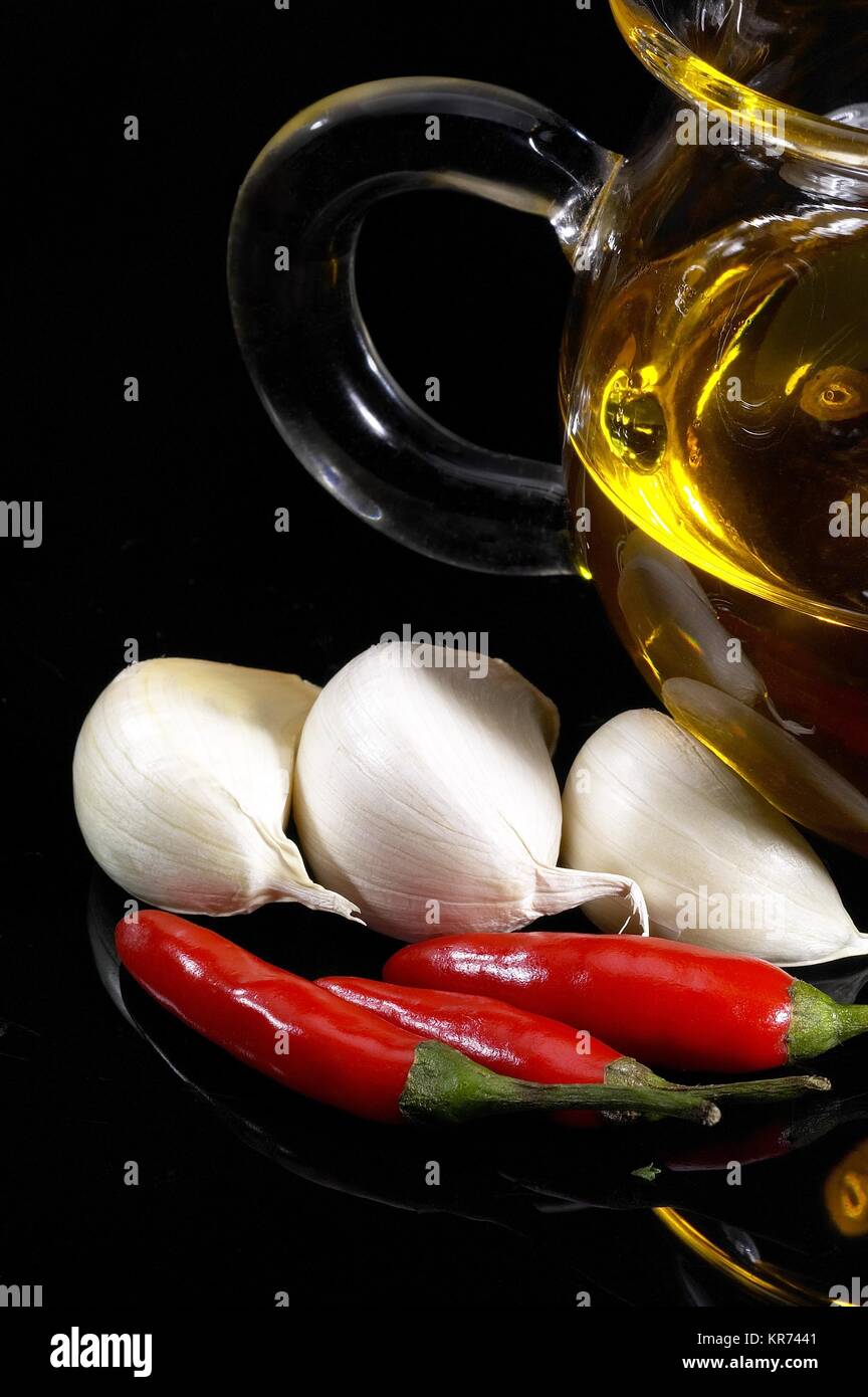 garlic extra virgin olive oil and red chili pepper Stock Photo - Alamy