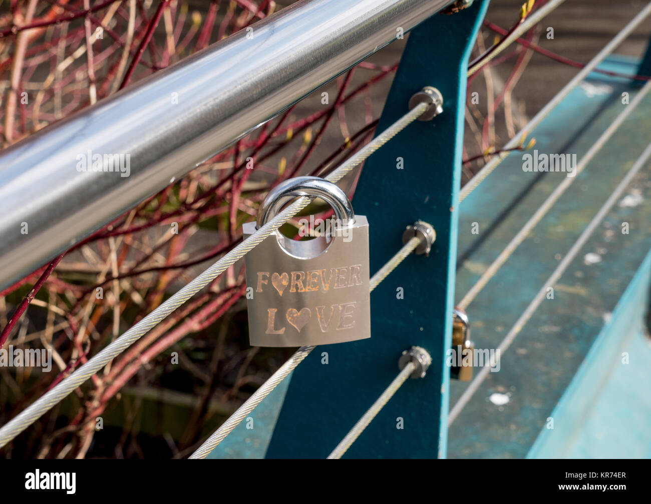Love locks secured to the Bridge over the River Wye in Bakewell ...