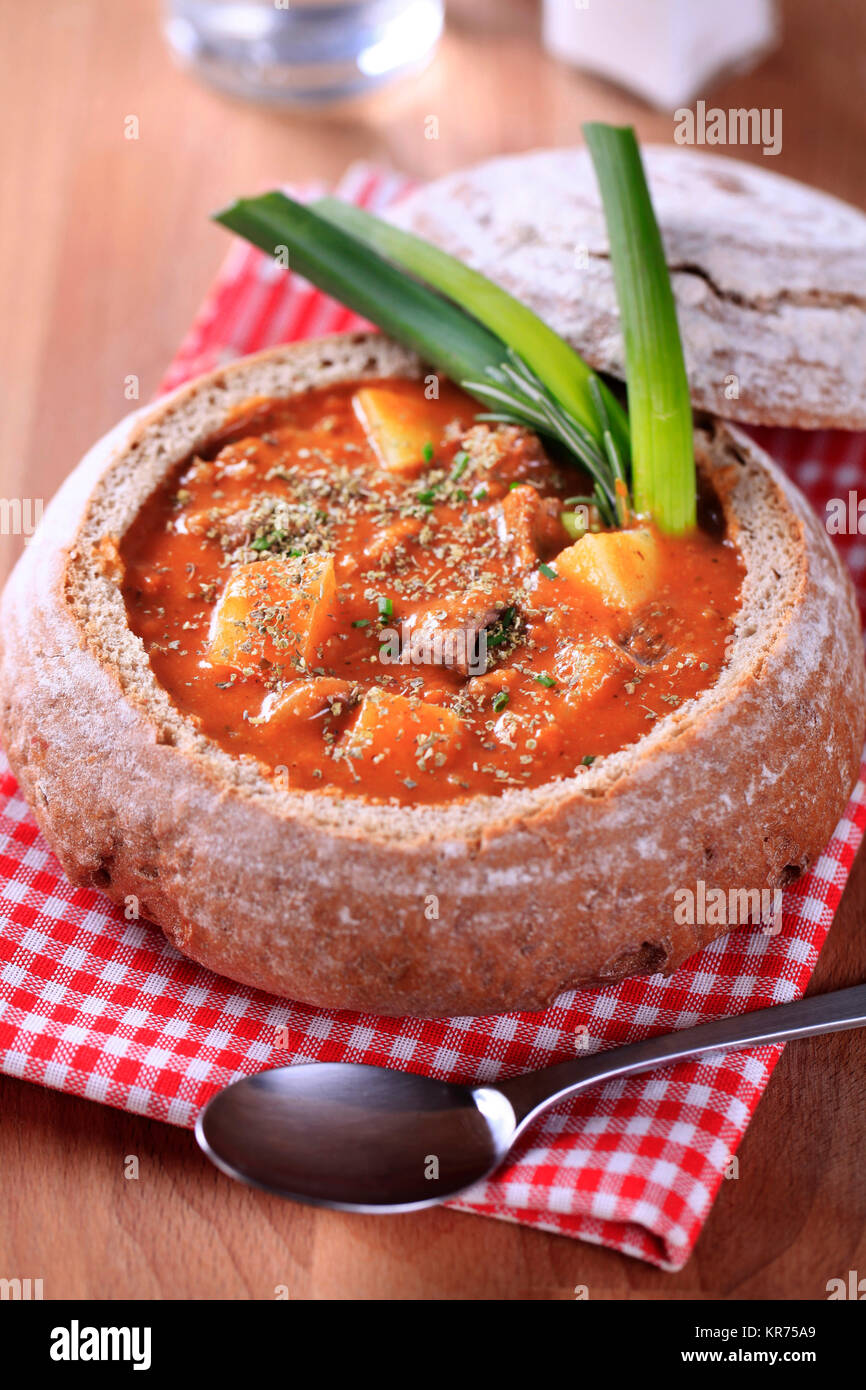 Goulash in bread bowl Stock Photo - Alamy