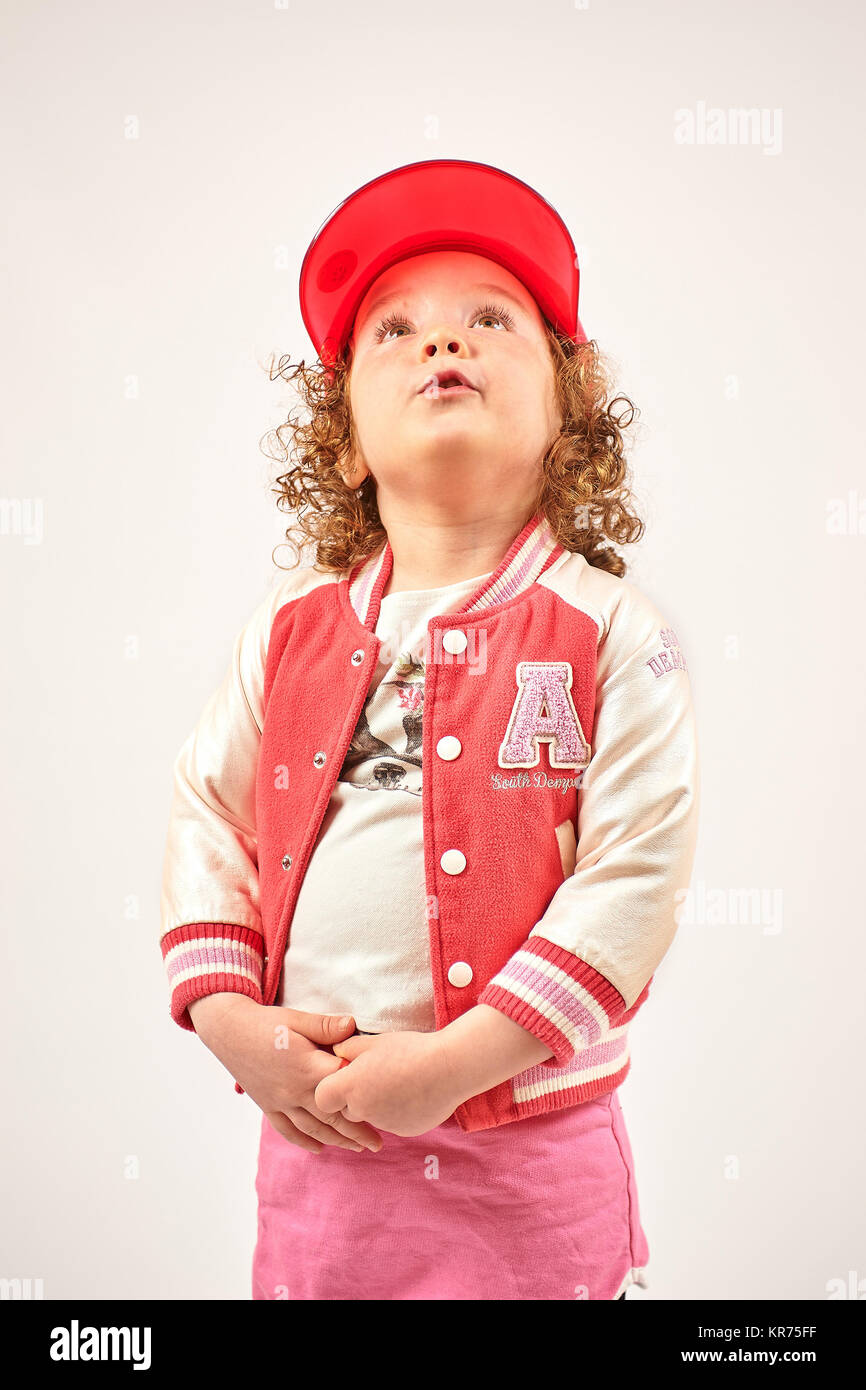 Little Girl Fashion Model With Red Cap Stock Photo - Alamy